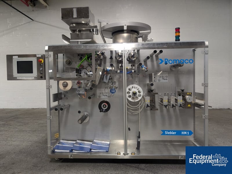 Romaco #SIEBLER-HM-1/230, strip packing machine, 10 lanes, 350 cycles/min, servos, 480V., 2008 ...